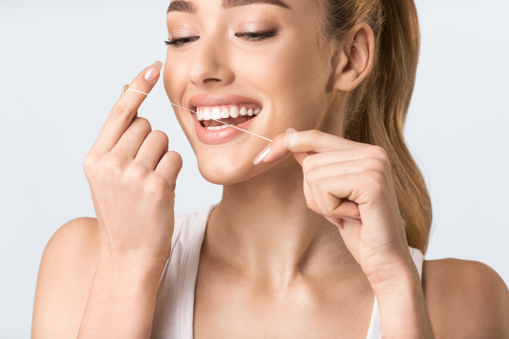 A Guide to Flossing: National Gum Health Month - Smiley Pearls